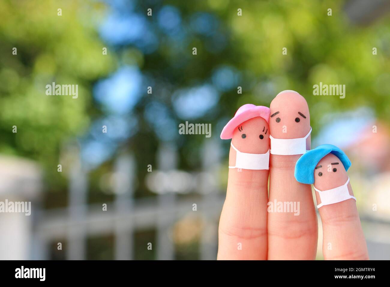Fingers art of family with face mask Stock Photo - Alamy