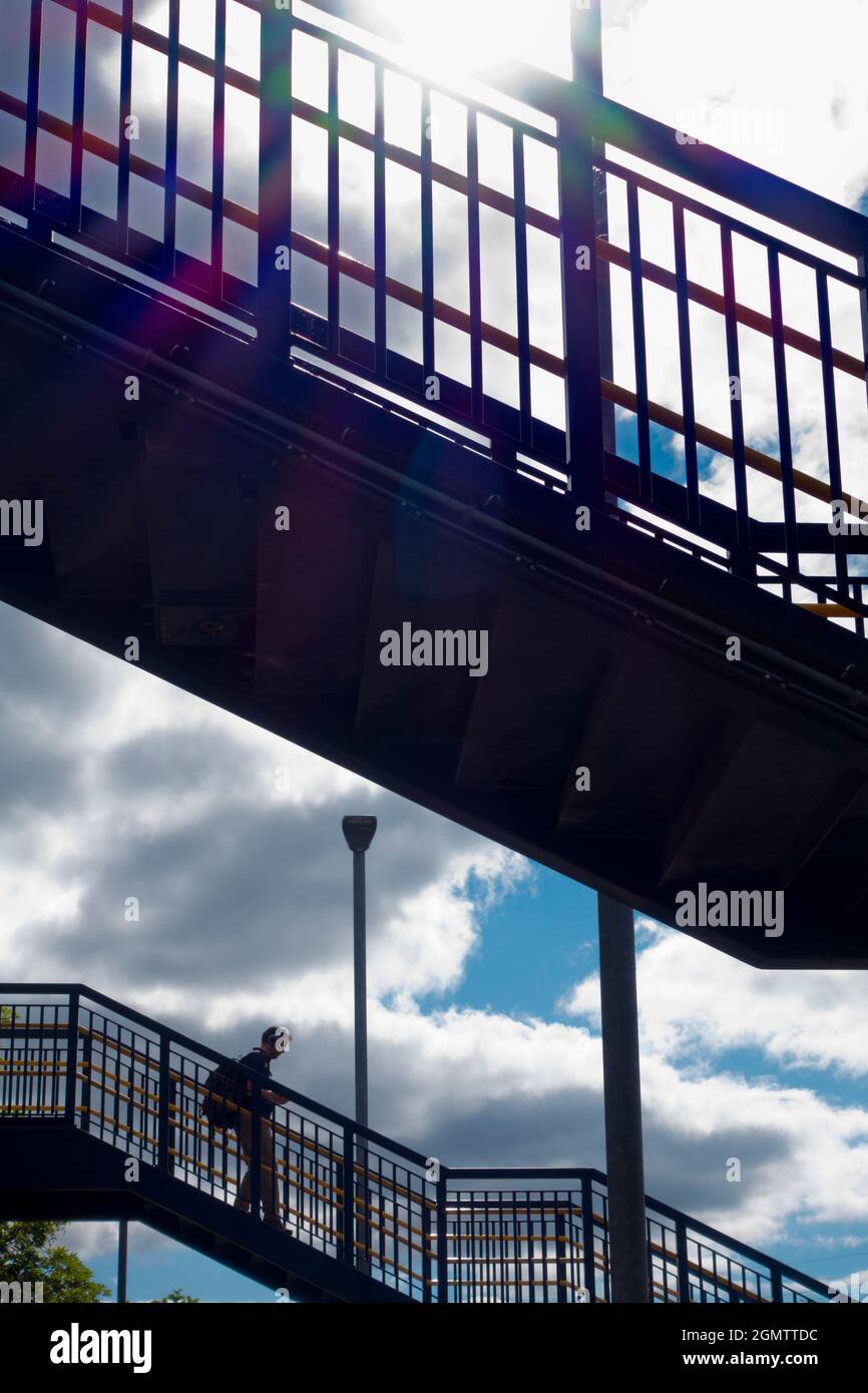 Radley Village, Oxfordshire, England - 1 July 2019; one silhouetted man ...