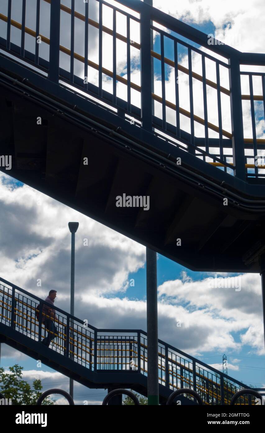 Radley Village, Oxfordshire, England - 1 July 2019; one silhouetted man ...