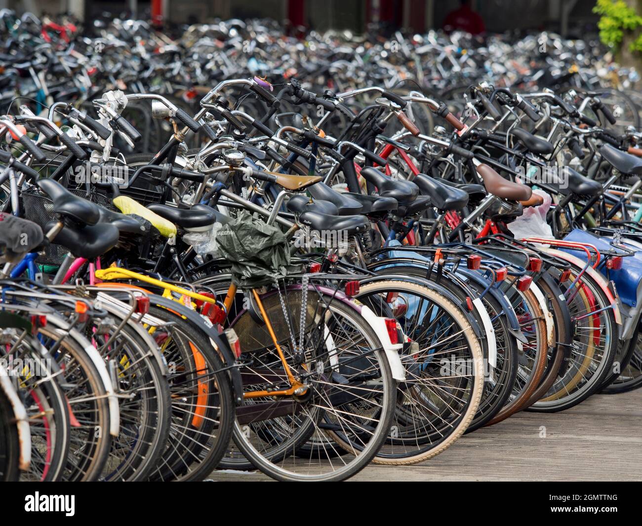 Amsterdam, the Netherlands - 26 May 2016; no people in view. Massed bicycles parked in the bike ...