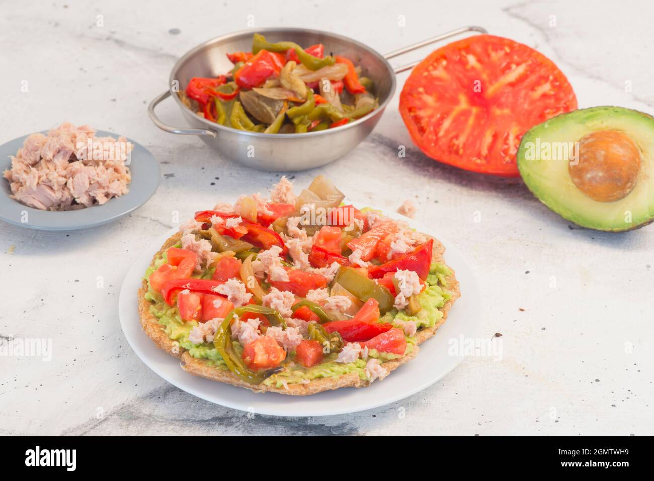 Mexican food- integral fajita with tuna, pepper, tomato and avocado ...
