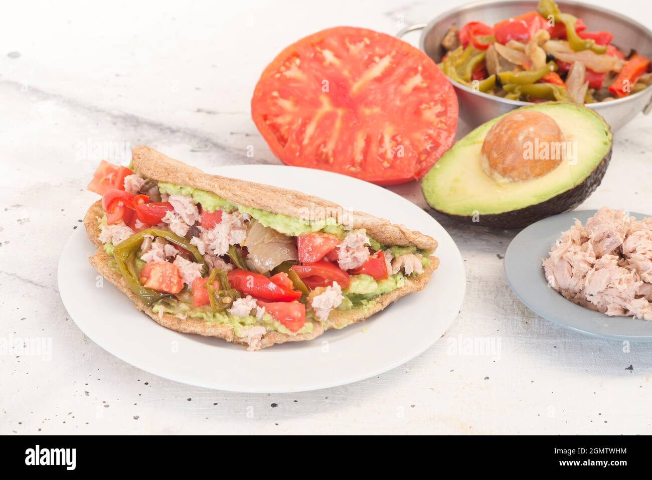 Mexican food- integral fajita with tuna, pepper, tomato and avocado ...