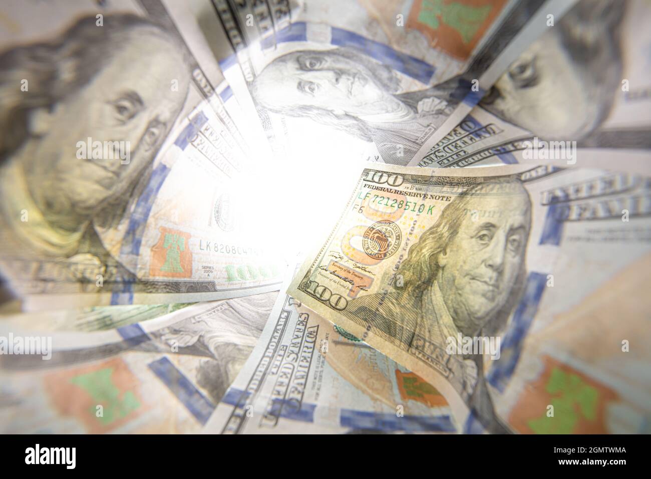 fan of 100 dollar banknotes on black glitter background Stock Photo - Alamy