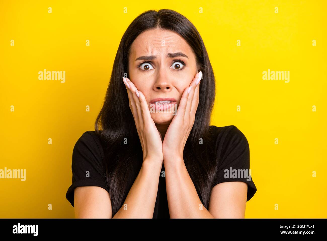 Photo of scared worried lady palms cheeks look camera wear black t ...