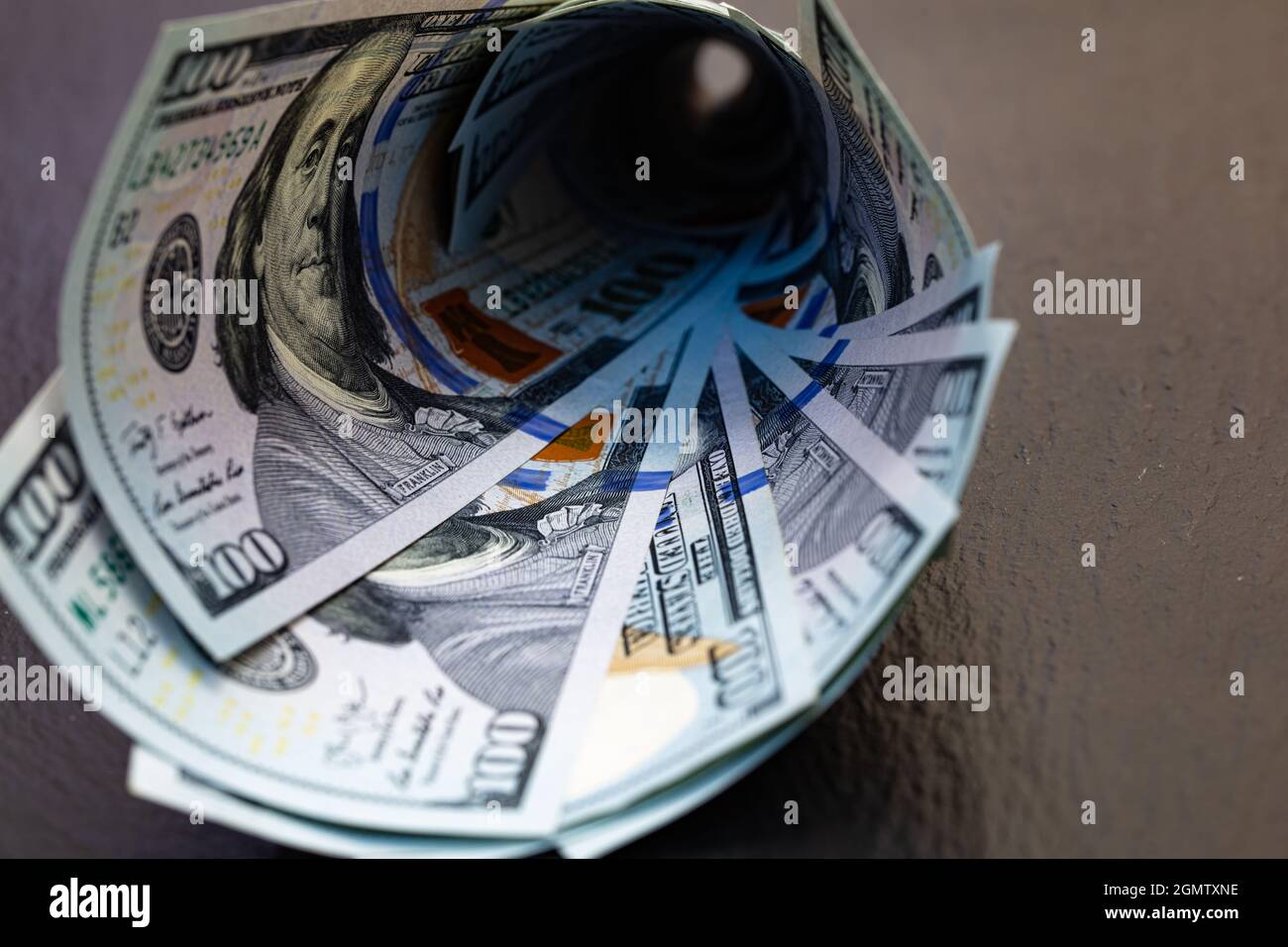 fan of 100 dollar banknotes on black glitter background Stock Photo - Alamy