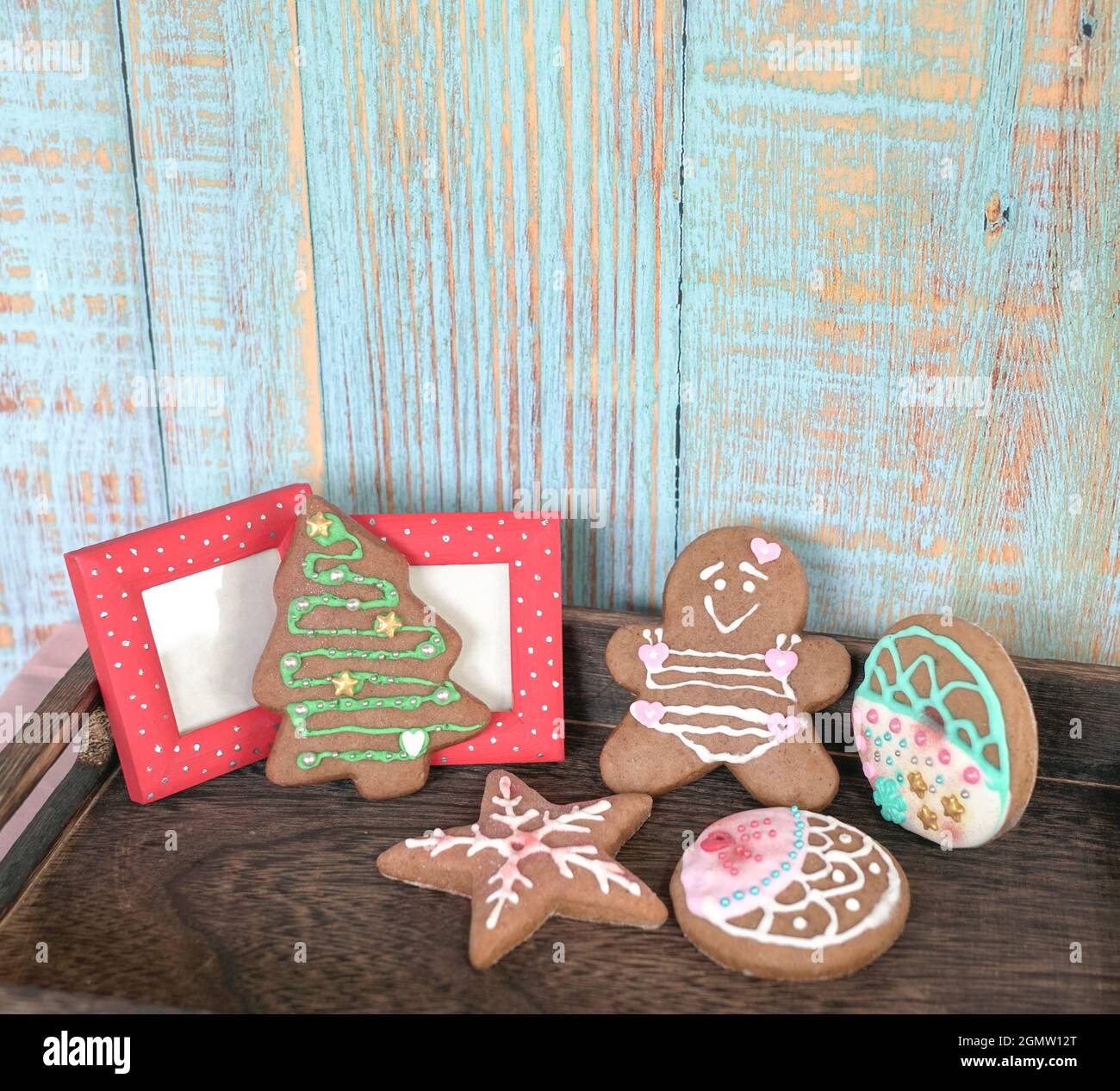 Assortment of gingerbread cookies displayed on a brown tray Stock Photo ...
