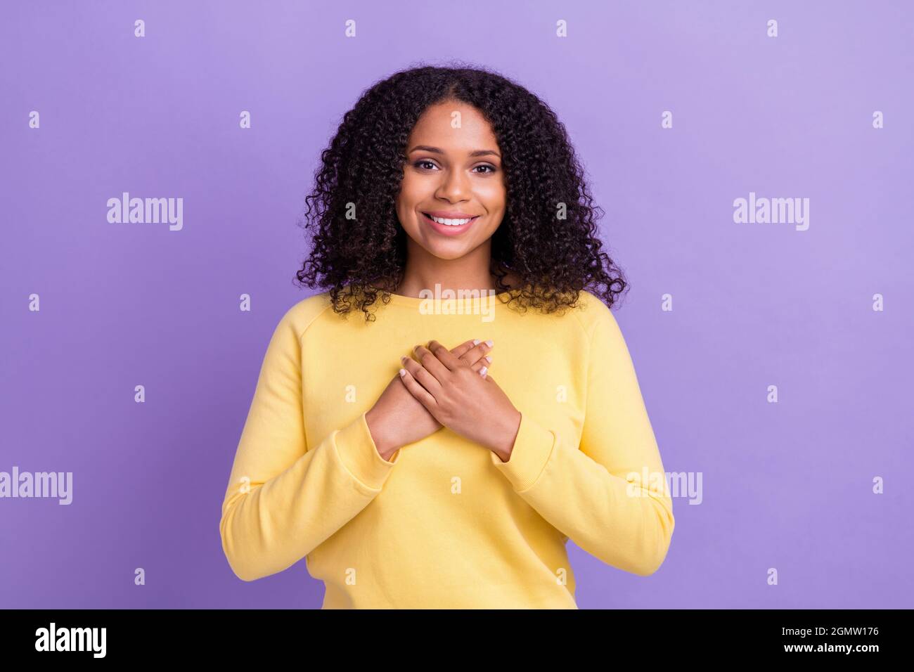 Photo of peaceful charming dark skin woman wear yellow sweater smiling ...