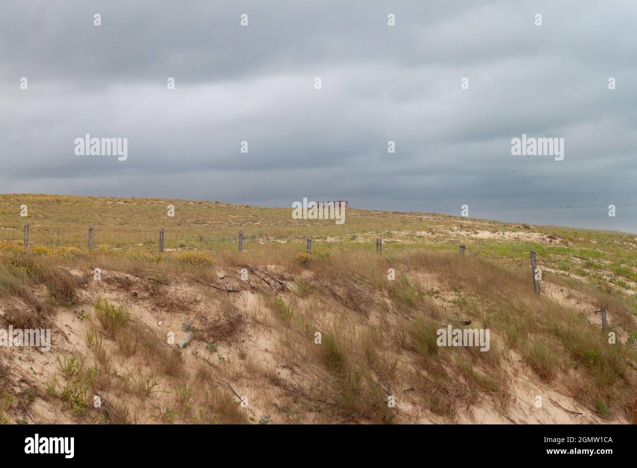 WWII blockhouse stands in the middle of the sand dunes of southwestern ...