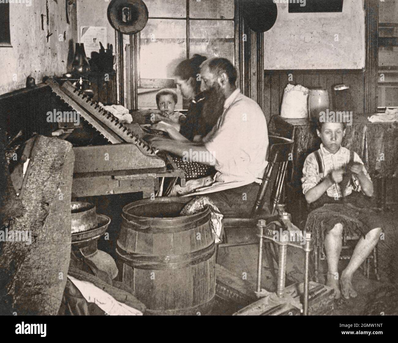 Jacob Riis photograph - Bohemian cigar makers at work in their rented ...