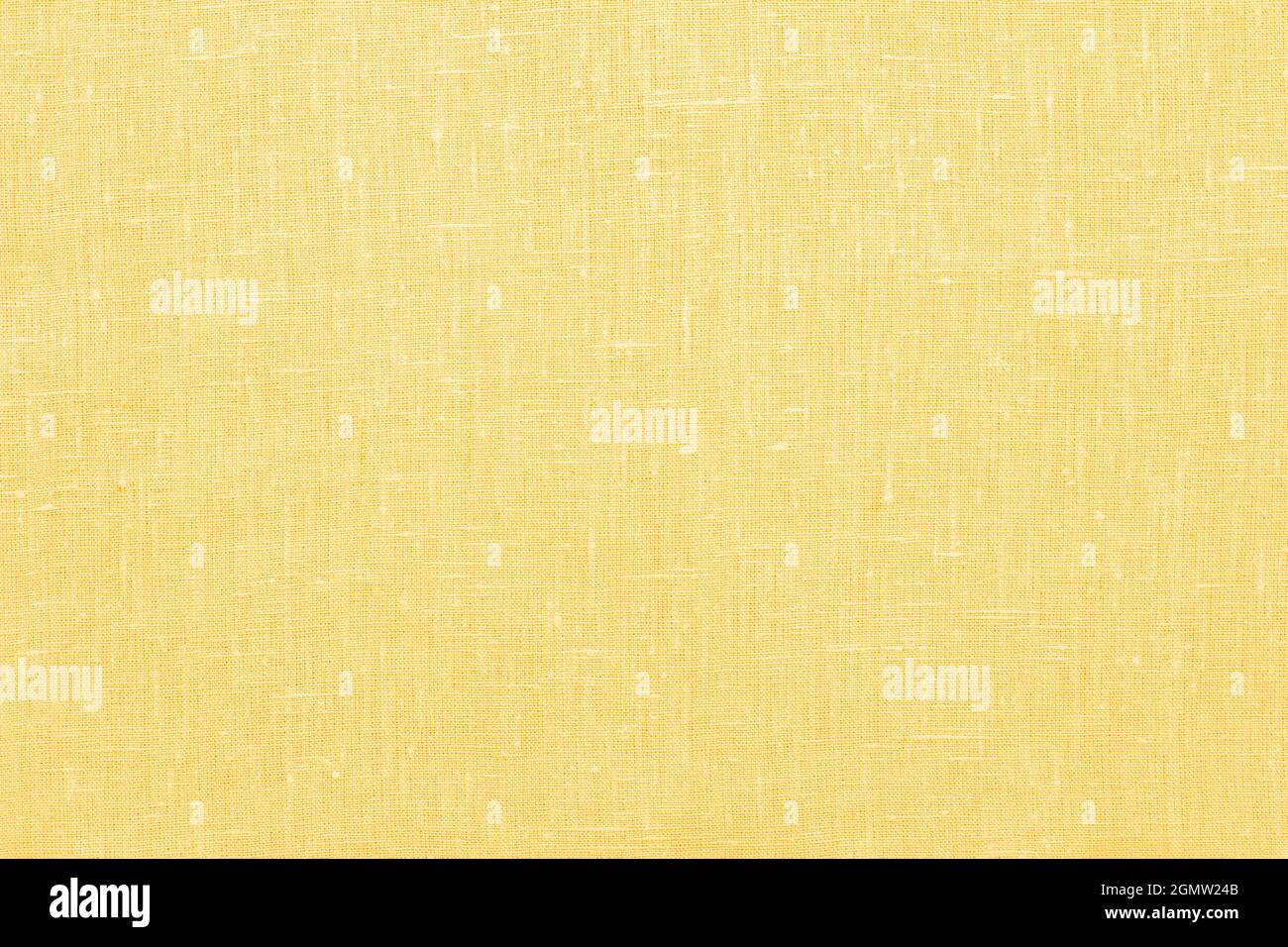 Yellow linen pastel fabric, background or texture, closeup, top view ...