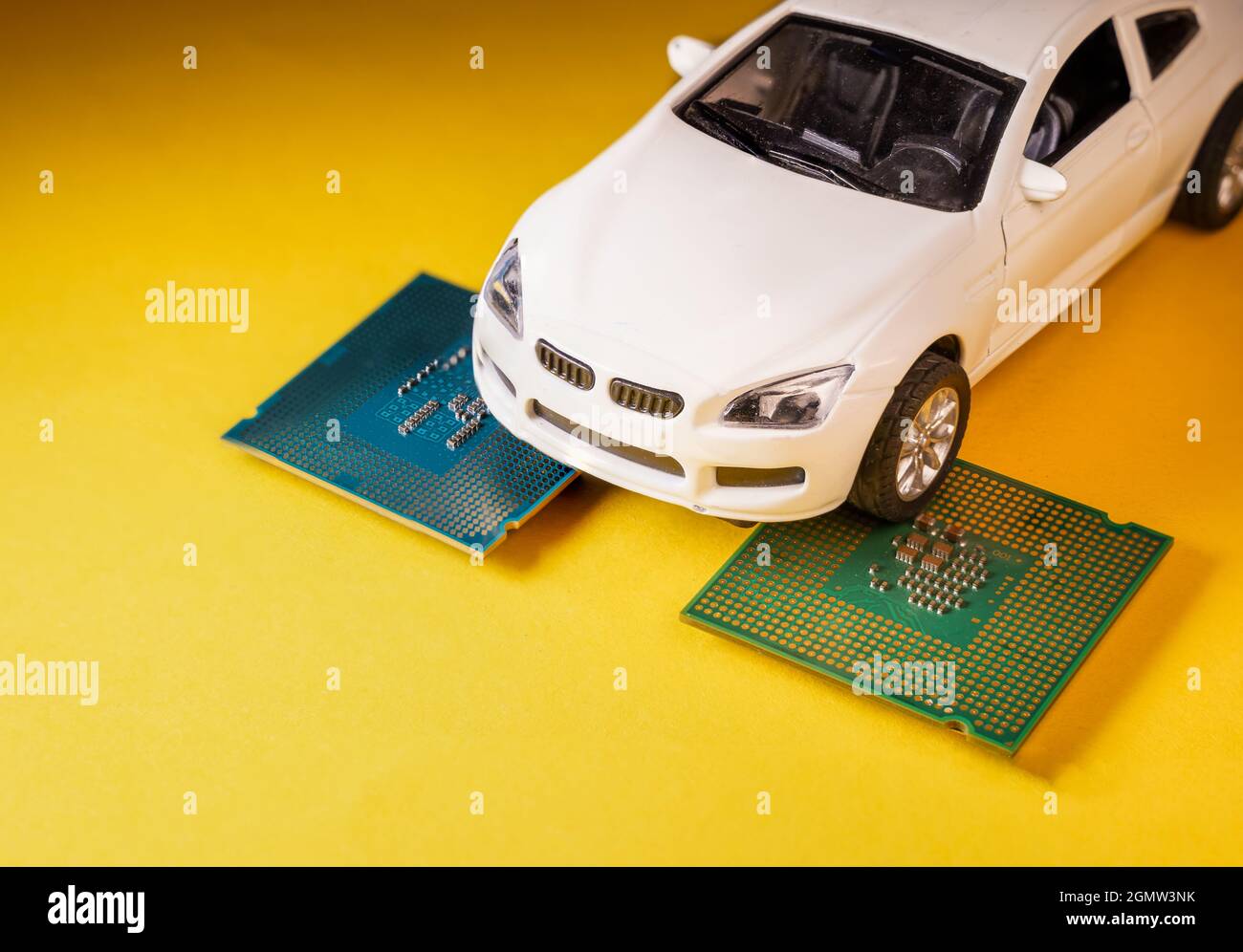 Close up view of a white toy car on top of a microprocessor . Selective ...