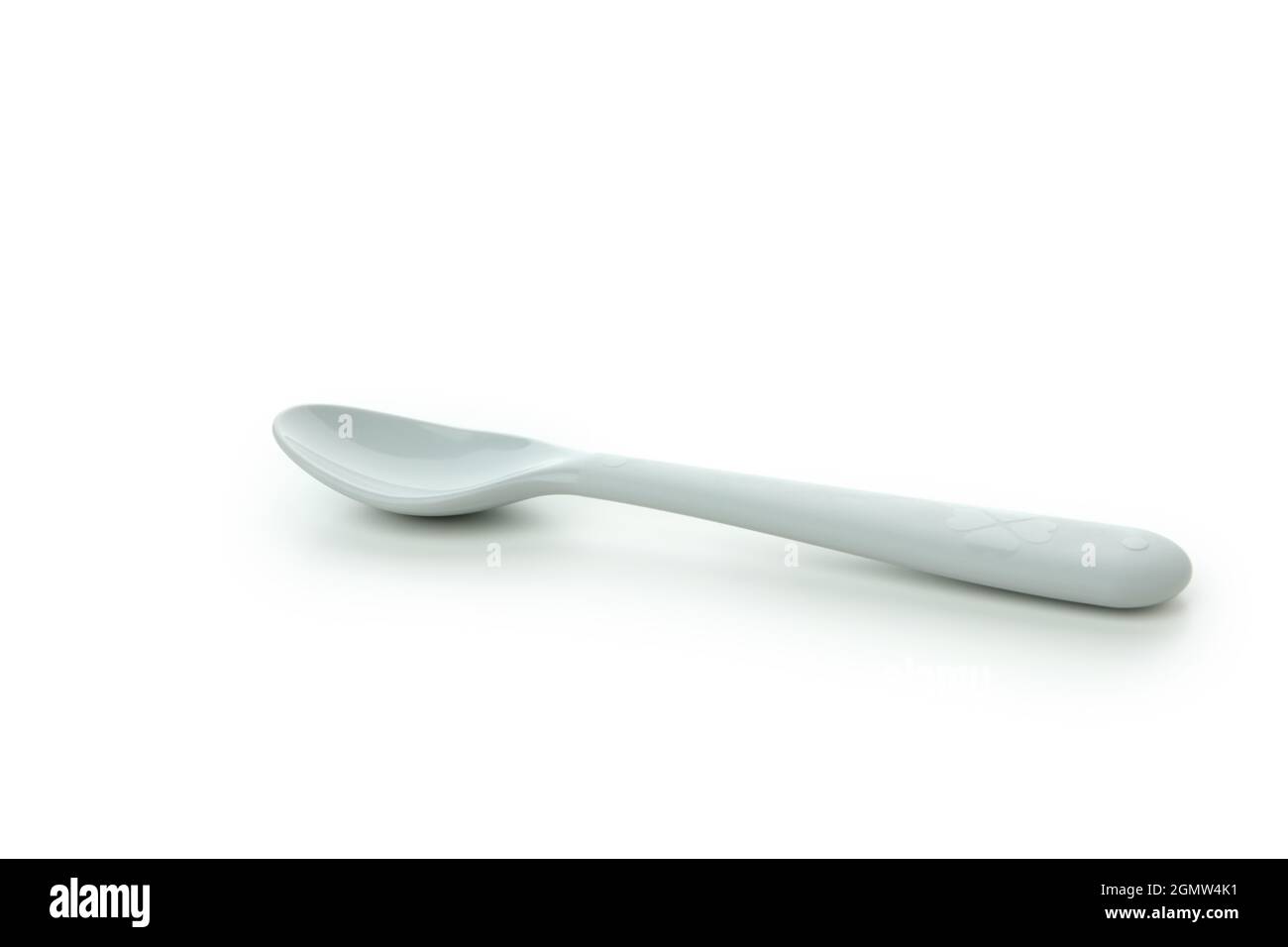 Single plastic spoon isolated on white background Stock Photo - Alamy