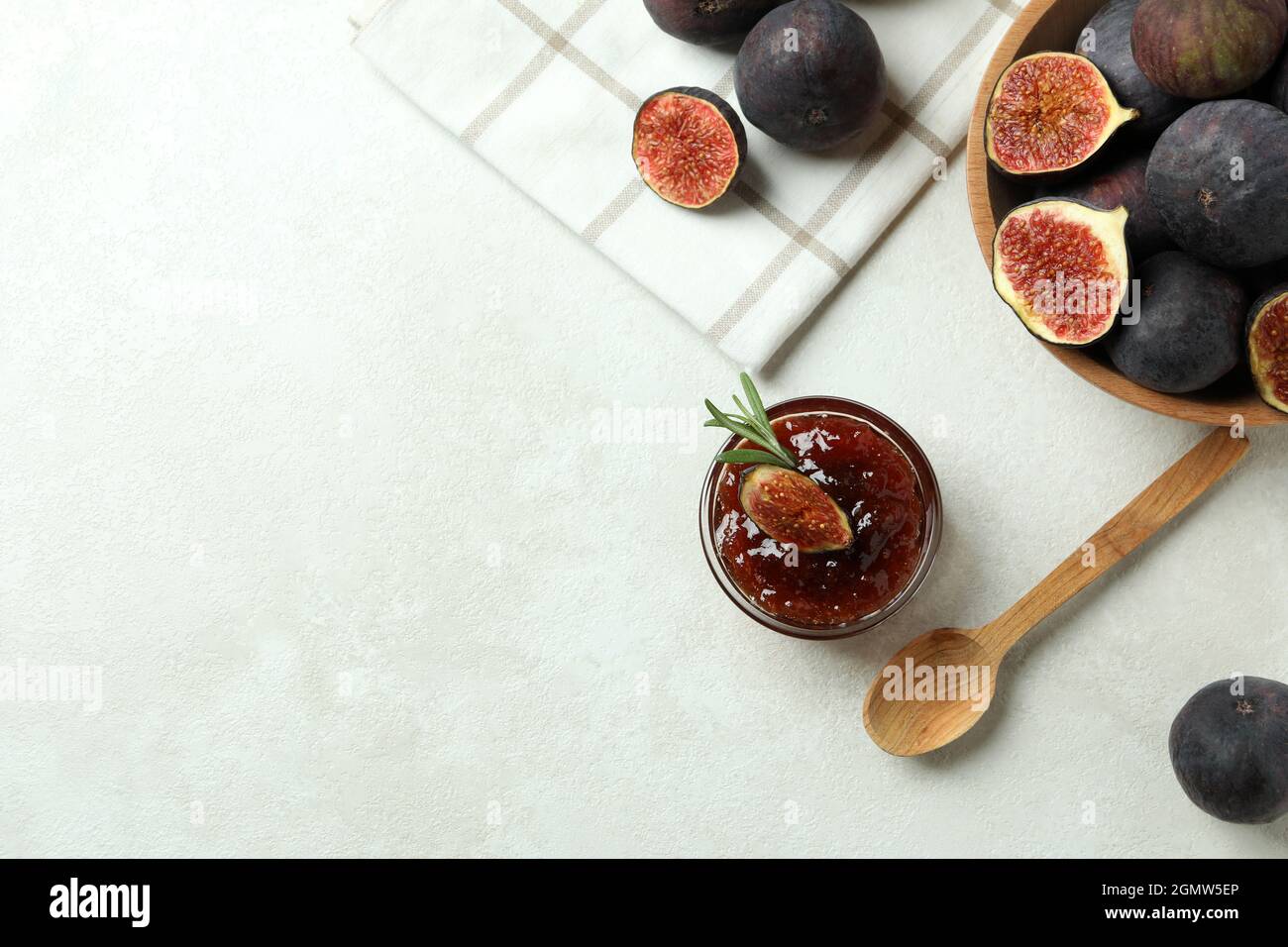 Concept of tasty food with fig jam on white textured background Stock ...