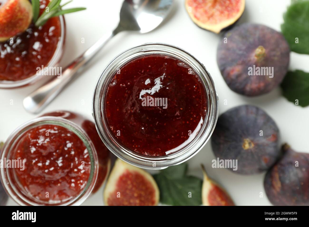 Concept of tasty food with fig jam on white background Stock Photo - Alamy