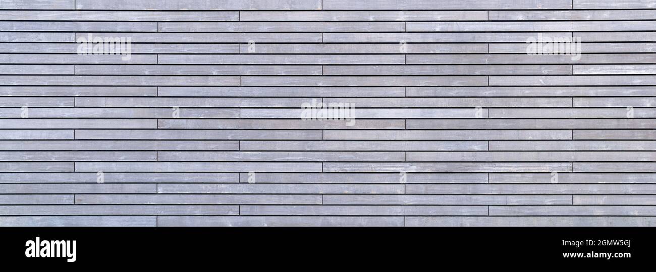 Gray wood paneling made of narrow horizontal boards on a facade Stock ...