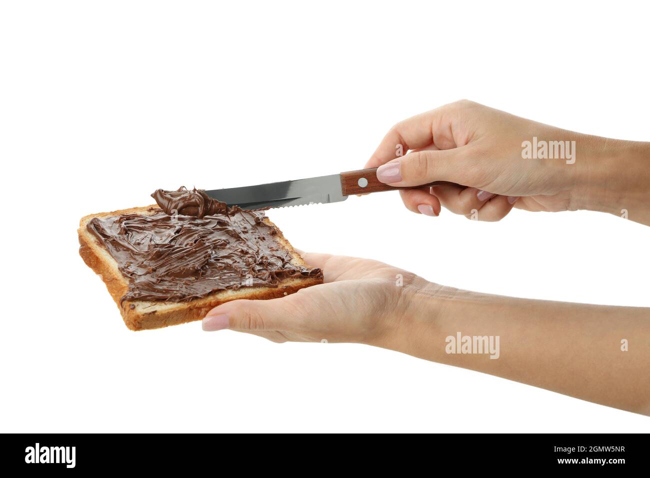 Female hands spread chocolate paste on bread, isolated on white ...