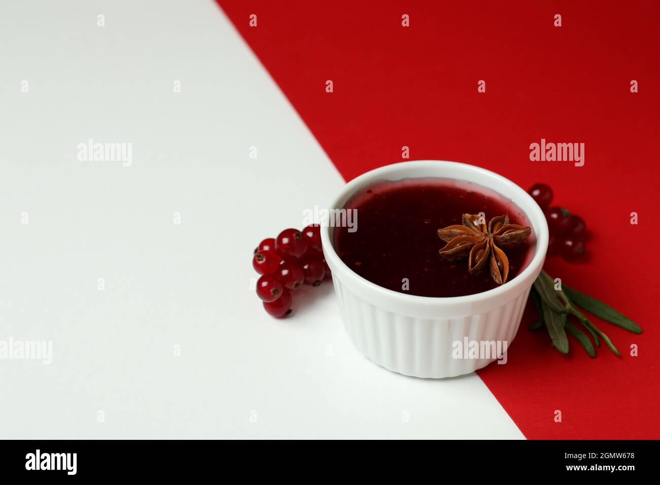 Cranberry sauce and ingredients on two tone background Stock Photo - Alamy