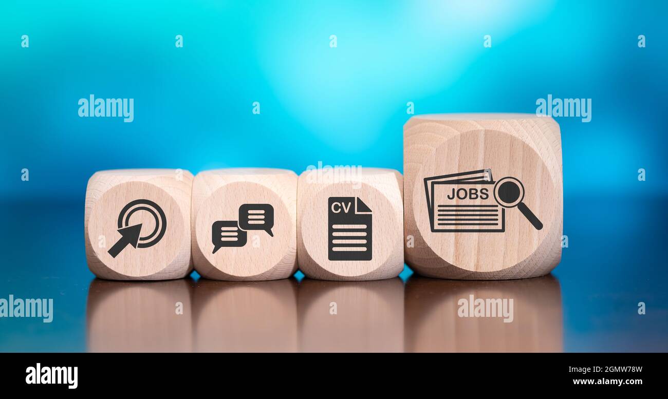 Wooden blocks with symbol of job search concept on blue background ...