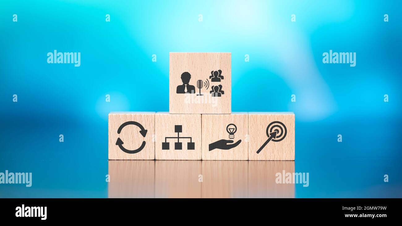 Wooden blocks with symbol of coaching concept on blue background Stock ...