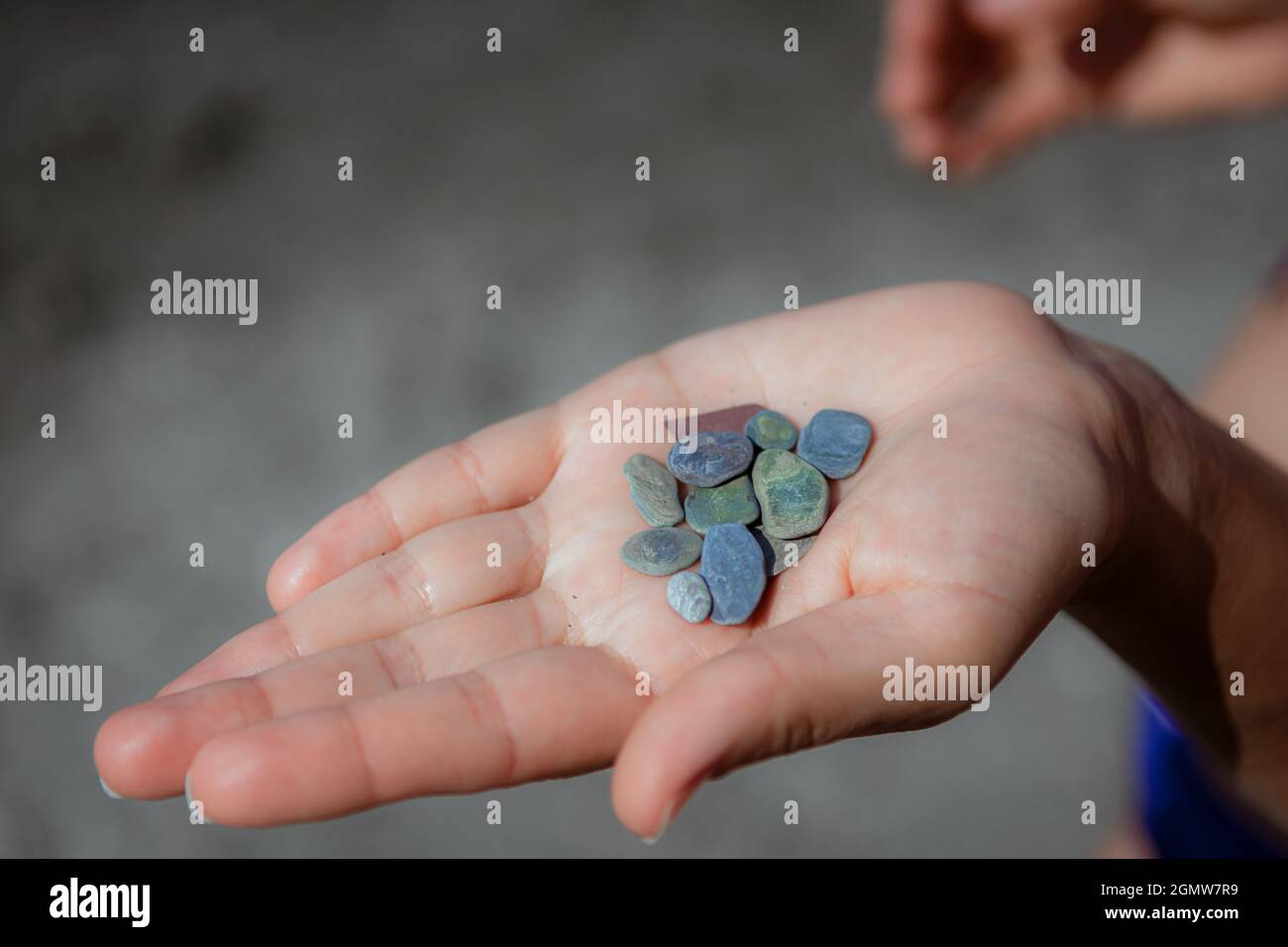 Hands holding stones hi-res stock photography and images - Alamy