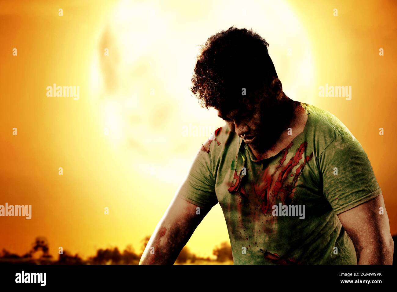 Scary zombie with blood and wound on his body standing with a night ...