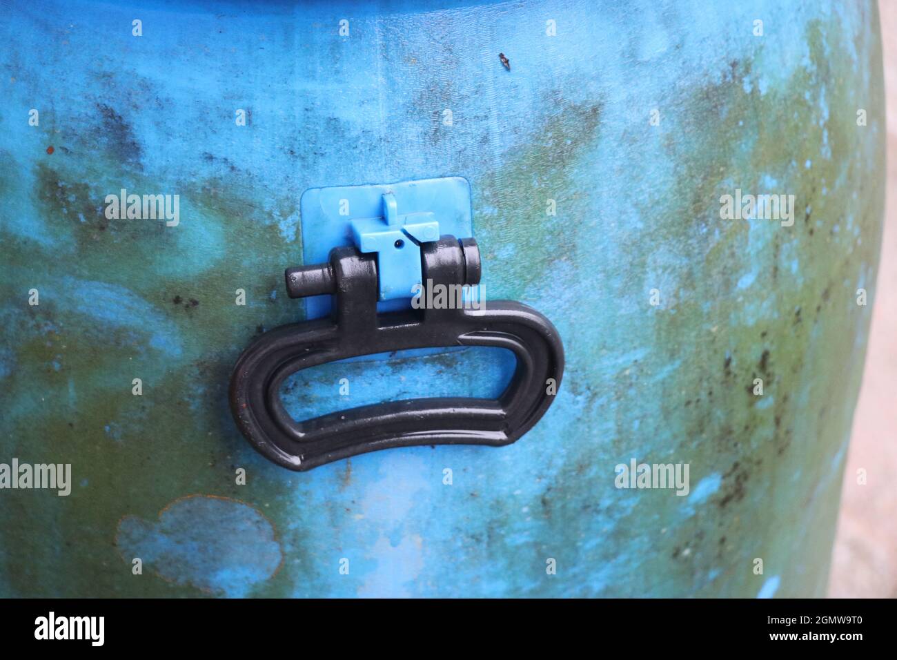 Plastic barrel with black handle, drum handle view from old water ...