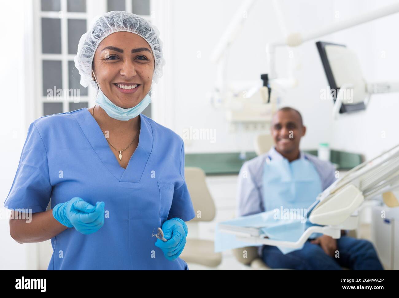 Confident professional dentist woman posing in dental clinic, looking ...