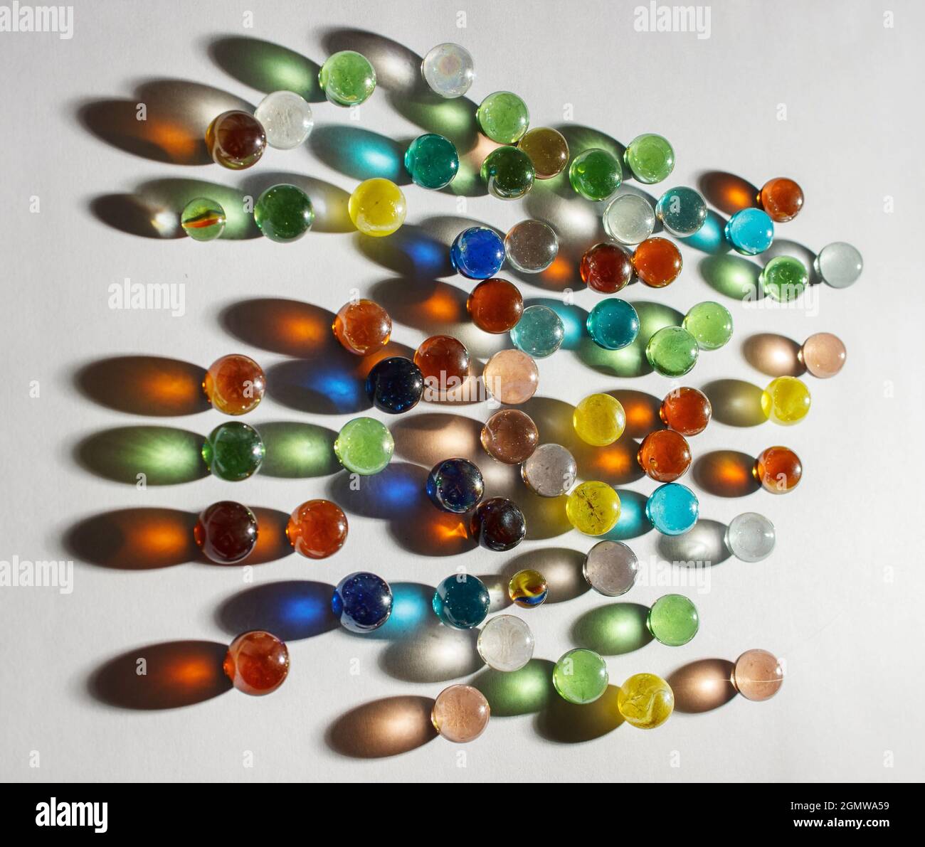 multicolored glass balls on the table indoor closeup Stock Photo - Alamy