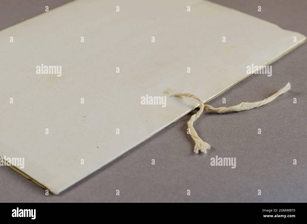 An old document folder with ties. Paper folder on gray backgroun Stock ...