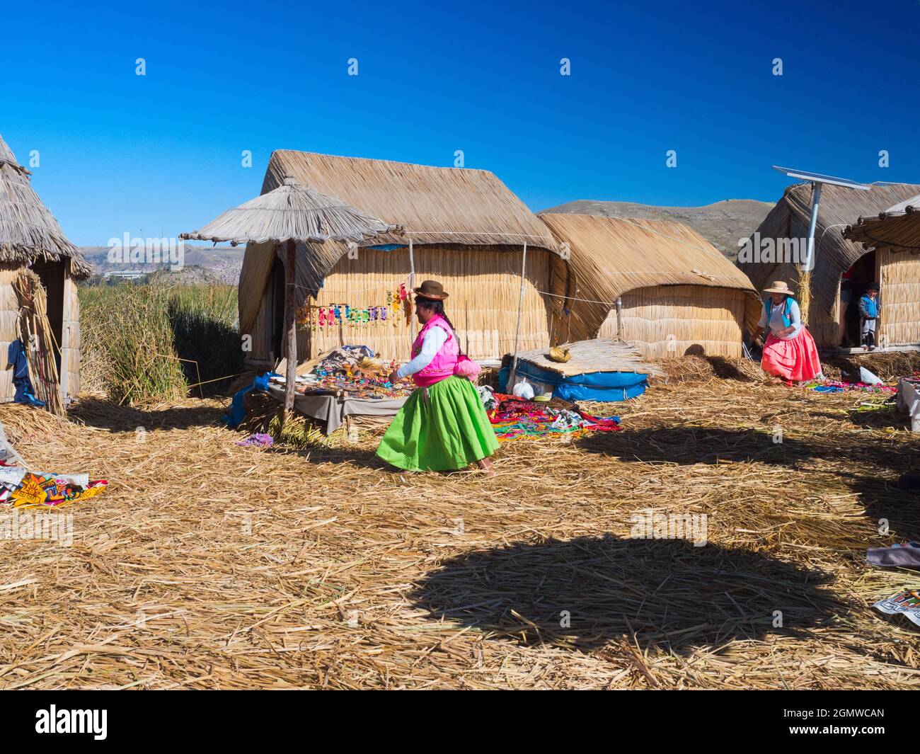 Lake Titicaca, Peru - 17 May 2018; three native people in shot Situated ...
