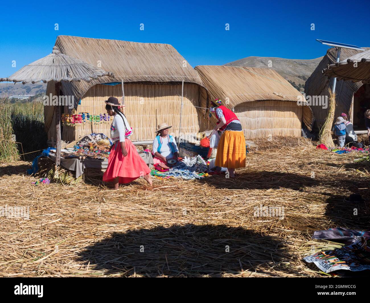 Lake Titicaca, Peru - 17 May 2018; three native people in shot Situated ...
