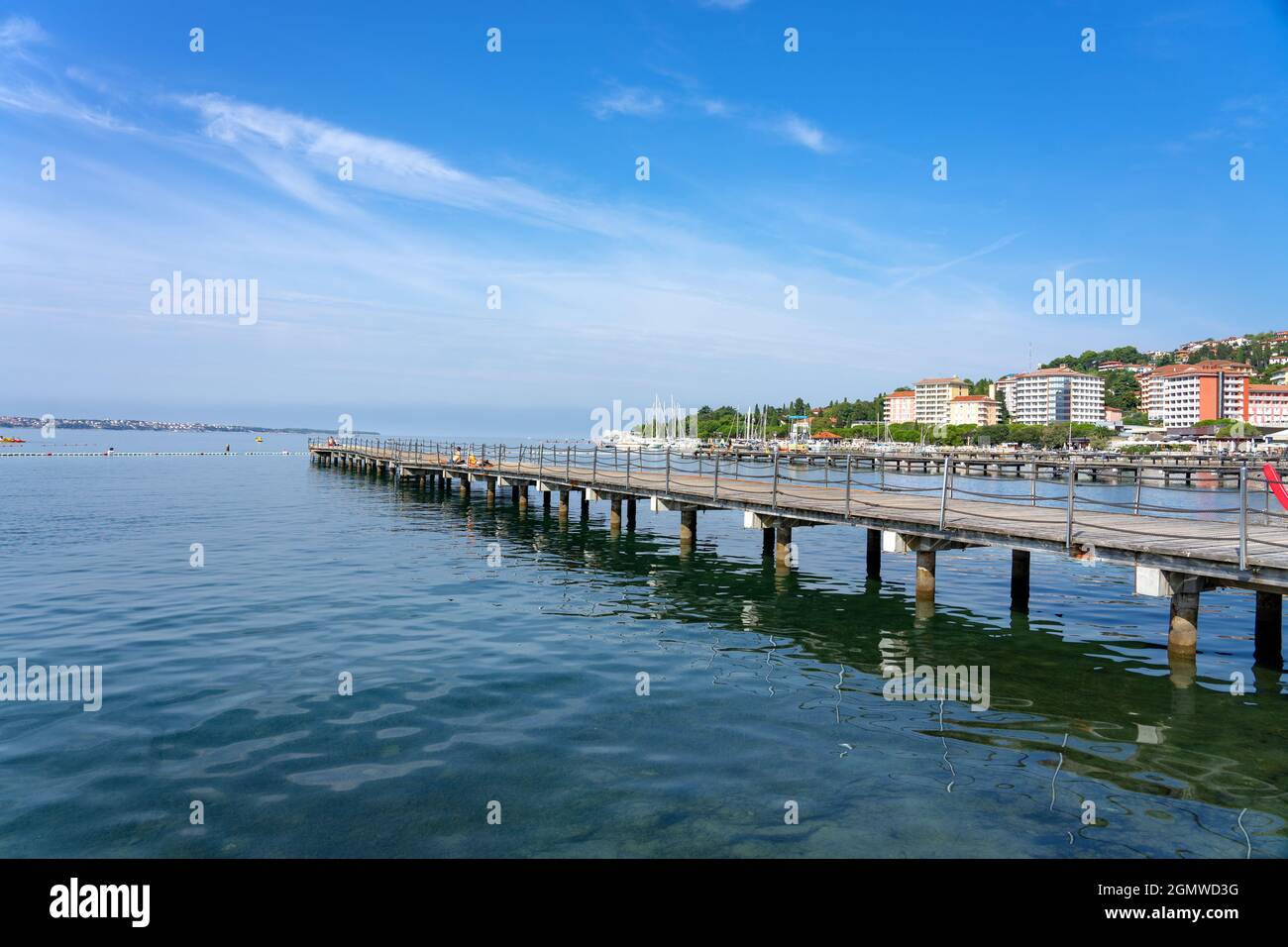 Portoroz central beach with pier and resort buildings Stock Photo - Alamy