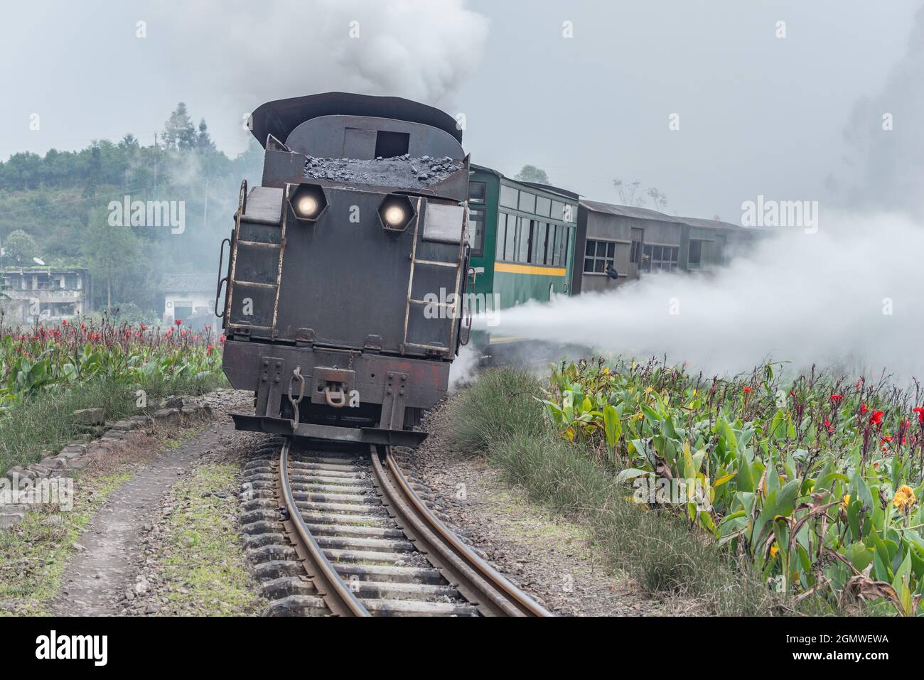 Steam retro train approaches to the station. China Stock Photo - Alamy