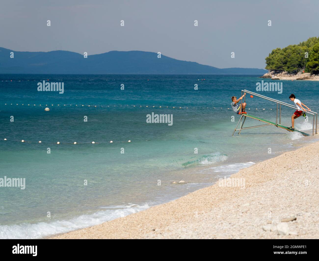 Two boys playing at the seaside hi-res stock photography and images - Alamy