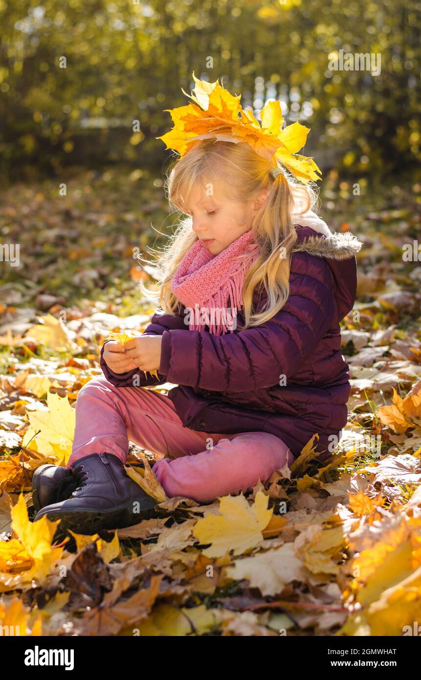 Lovely girl sitting in park hi-res stock photography and images - Alamy