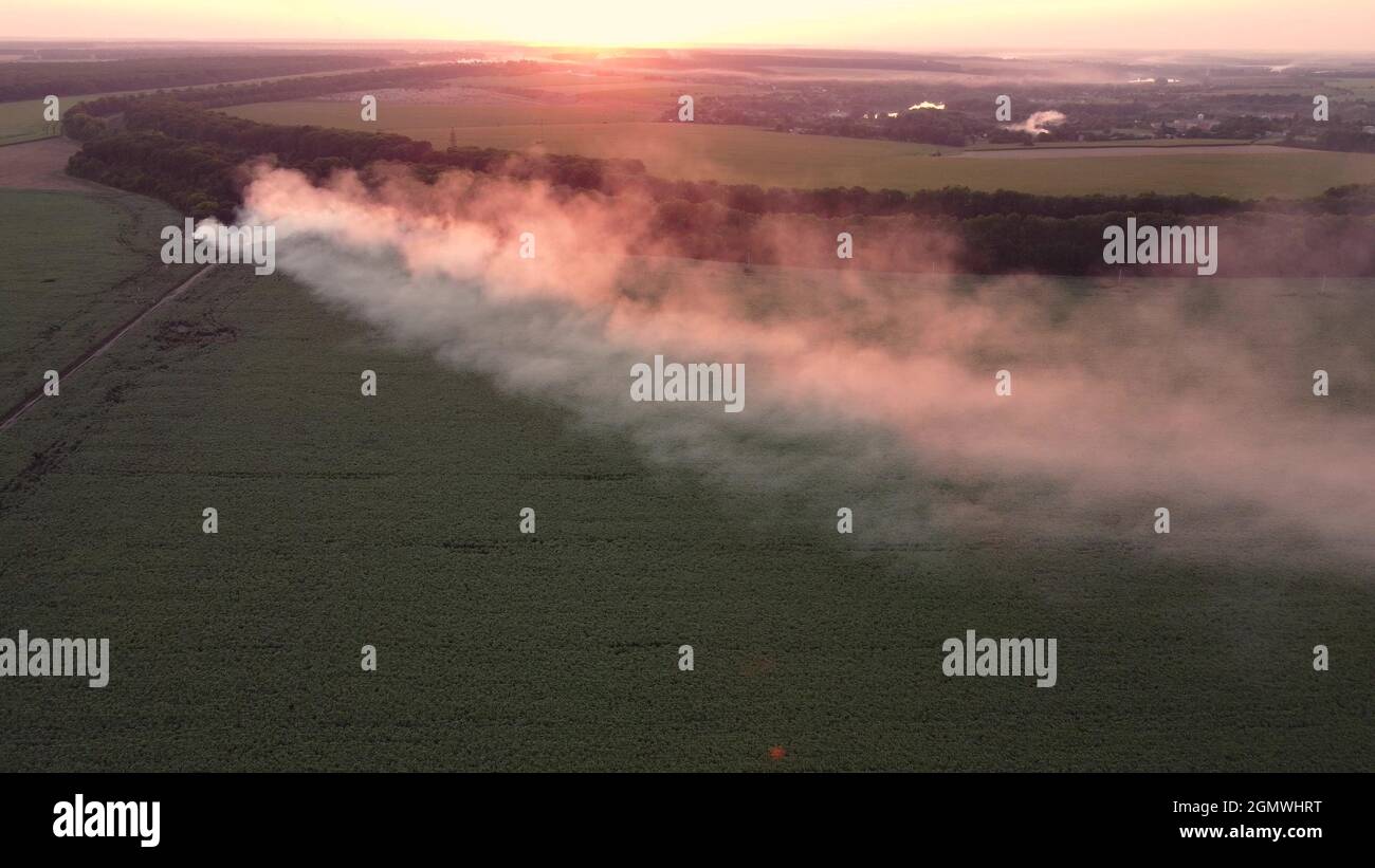 Smoke from burning garbage outside the city, aerial view, environmental ...