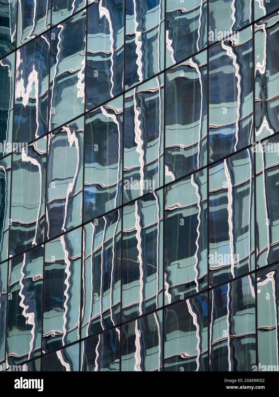 Distorted glass skyscraper hi-res stock photography and images - Alamy