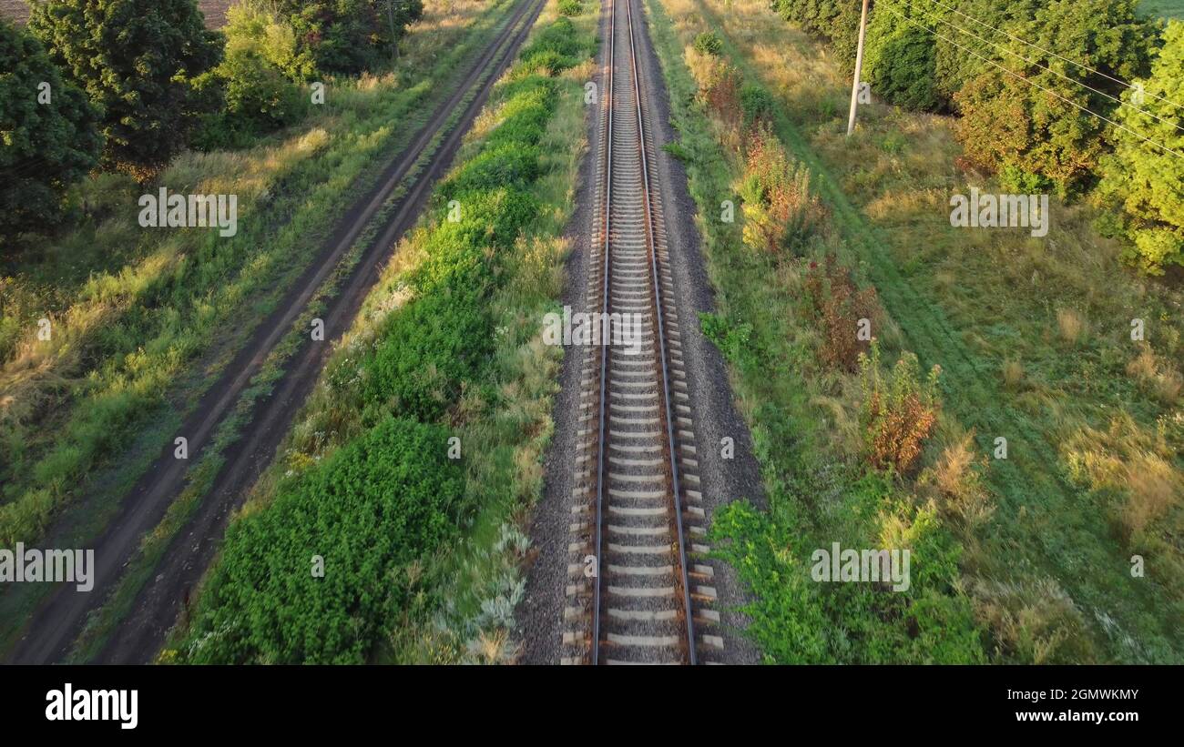 Railroad tracks top view. Flight over the road with rails Stock Photo ...