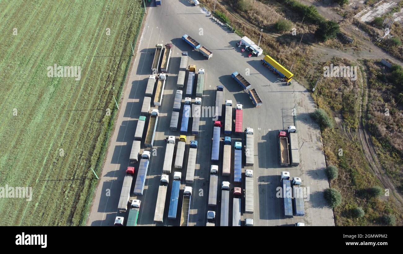 View from above on a large queue of trucks waiting at the port terminal ...