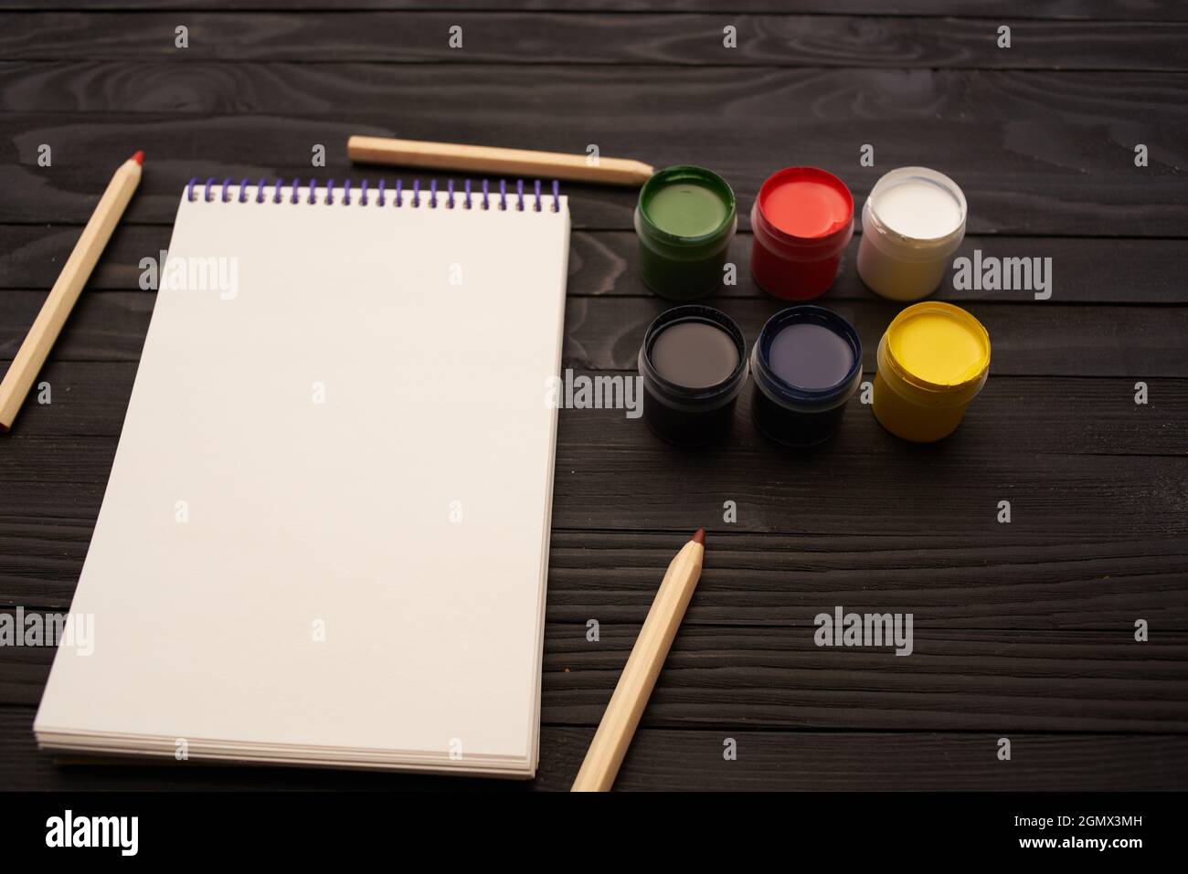 Notepad pencils paint drawing design creative art Stock Photo - Alamy