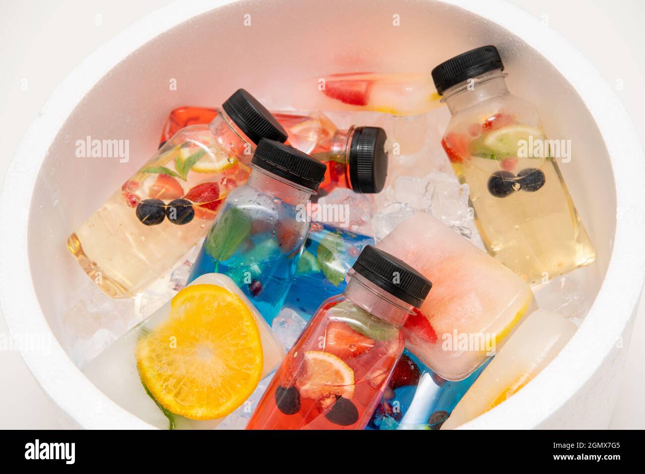 Fresh organic Fruits juices bottle in ice box. brand concept isolated ...