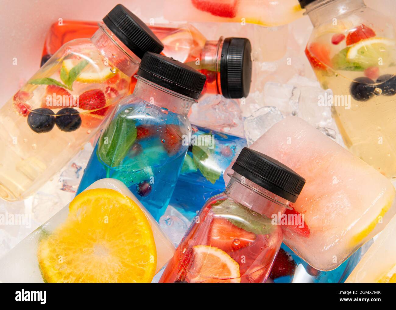 Fresh organic Fruits juices bottle in ice box. brand concept isolated ...