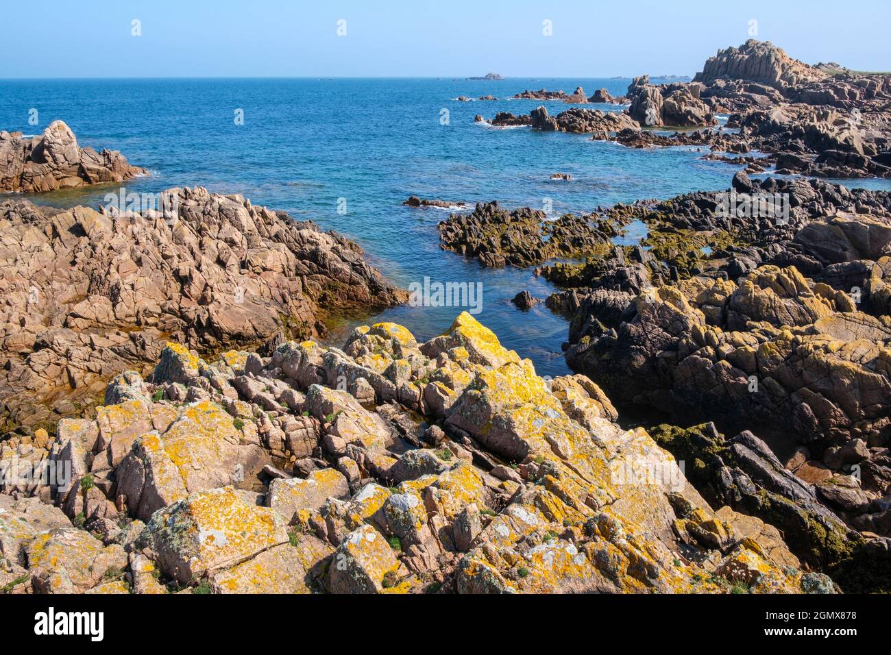 The rocky coast at Fort Hommet, Vazon Bay, Guernsey, Channel Islands ...