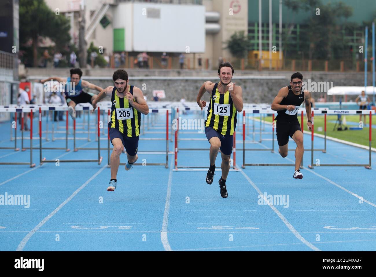 ISTANBUL, TURKEY - JUNE 23, 2021: Athletes running 100 metres hurdles ...