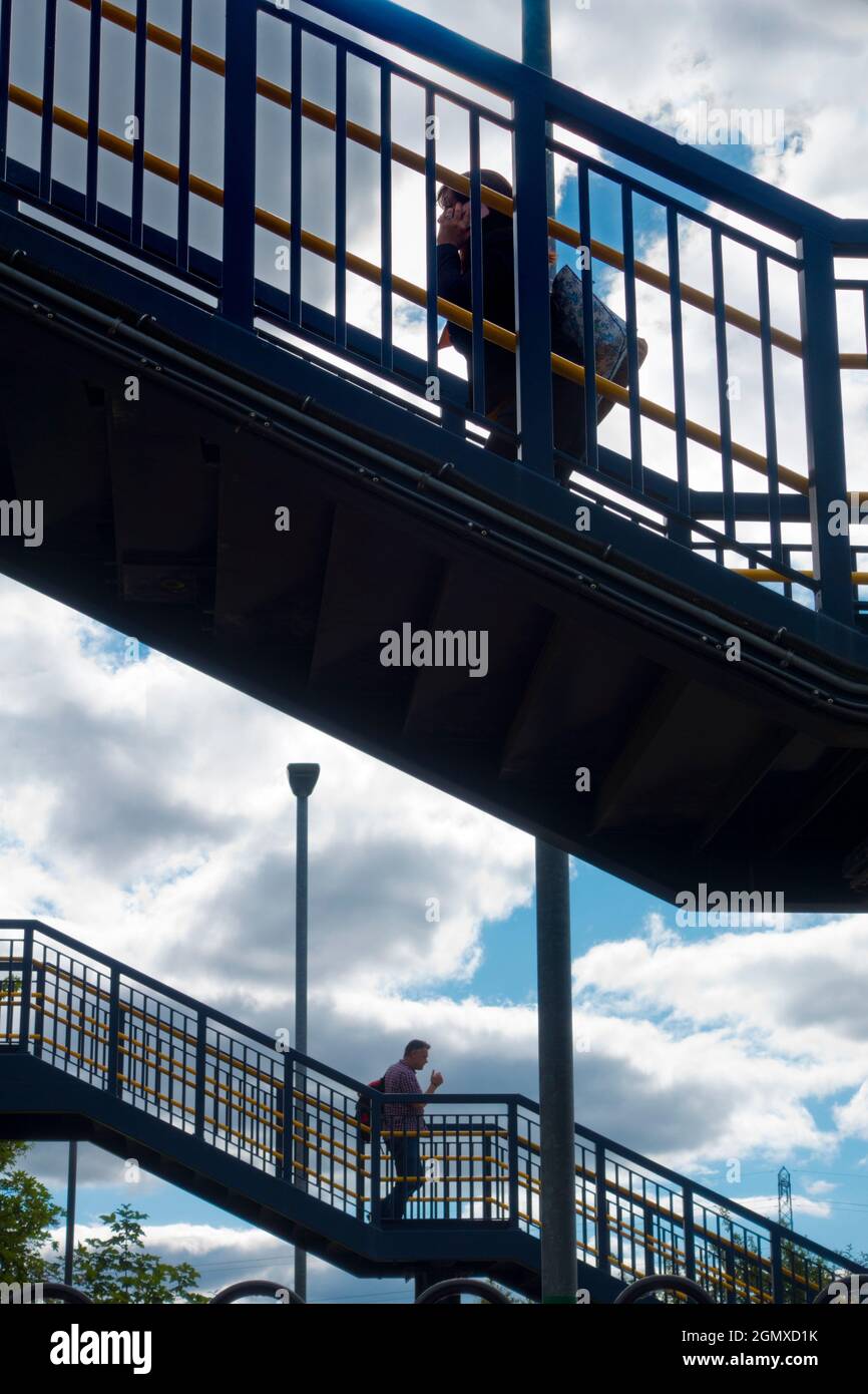Radley Village, Oxfordshire, England - 1 July 2019; one man ascending ...