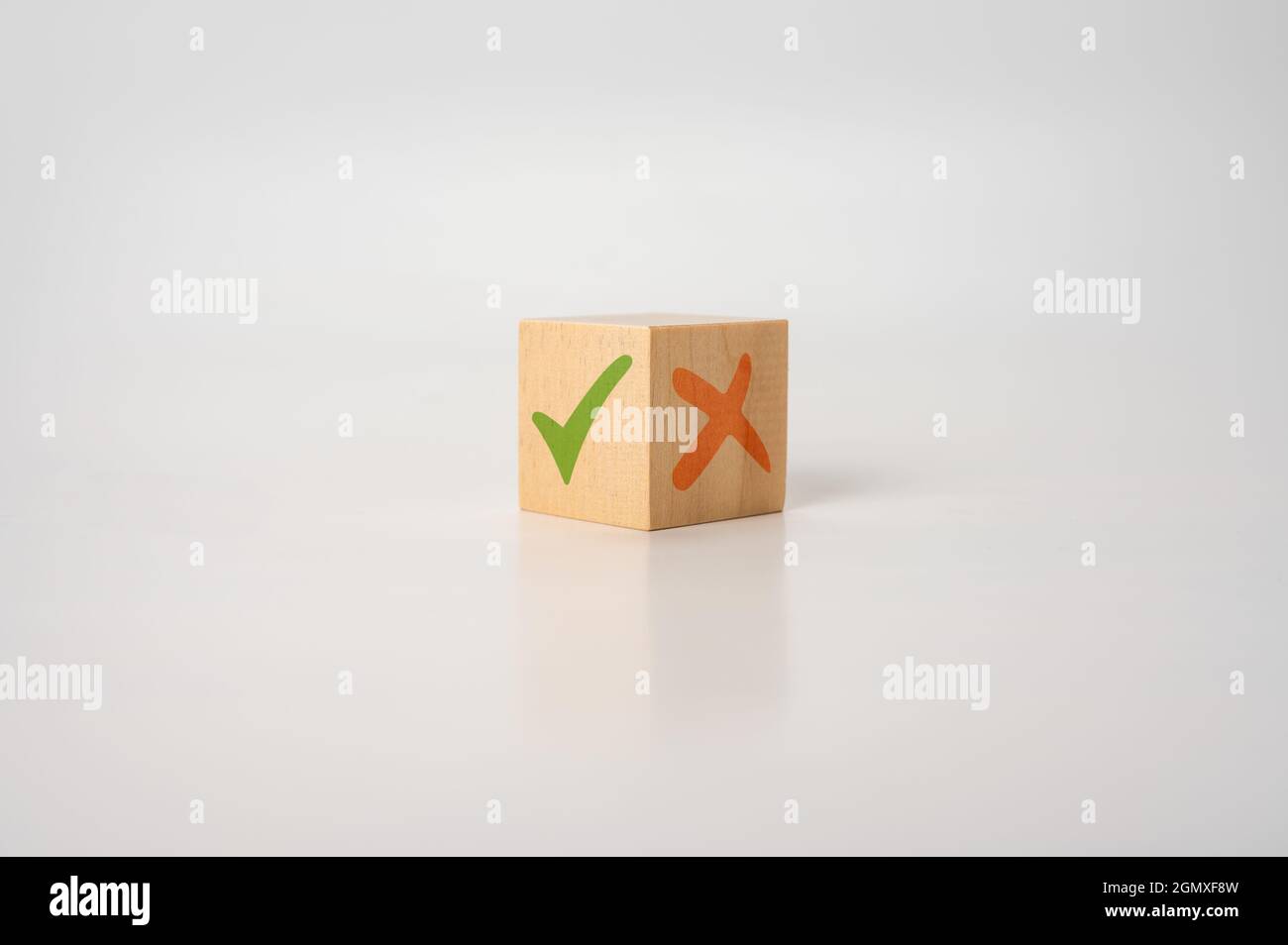 Tick mark and cross mark x on wooden cubes. pros and cons concept ...