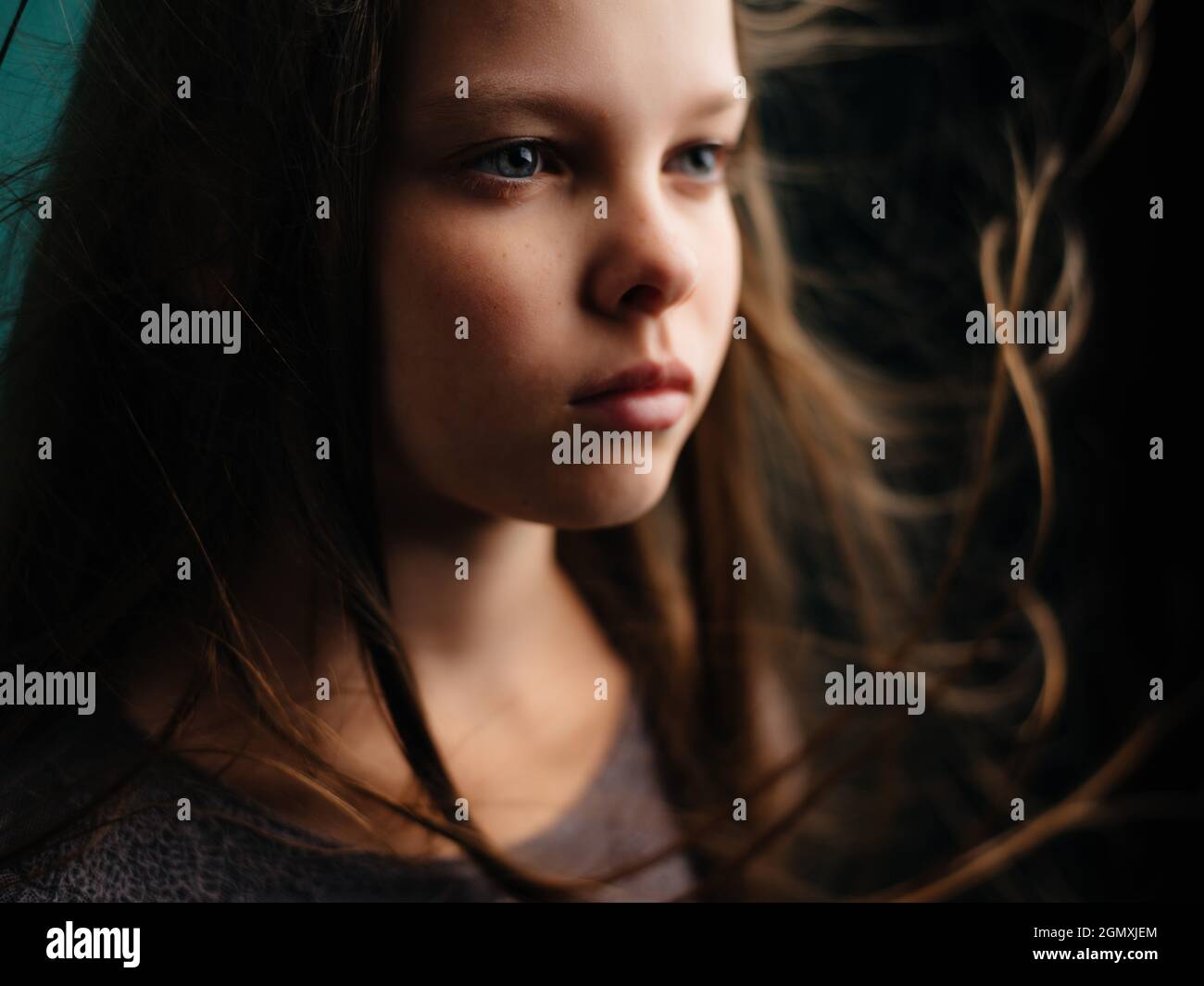 Girl in a dress long hair emotions depression Green background Stock ...