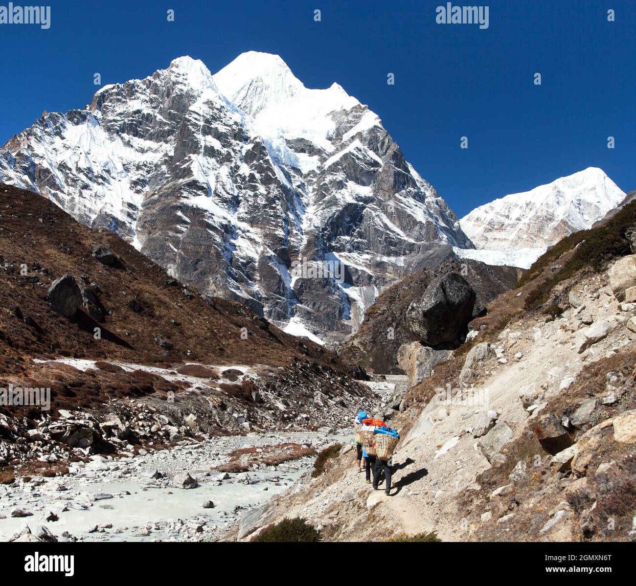 mount Hongku or Honku Chuli peak and three sherpas, way to Makalu base ...