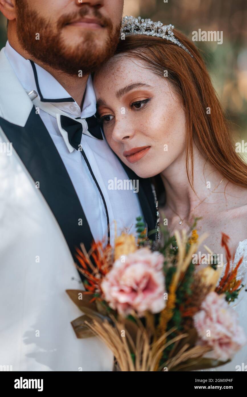 Bride and groom together, and looking eachother with fascinated wide ...
