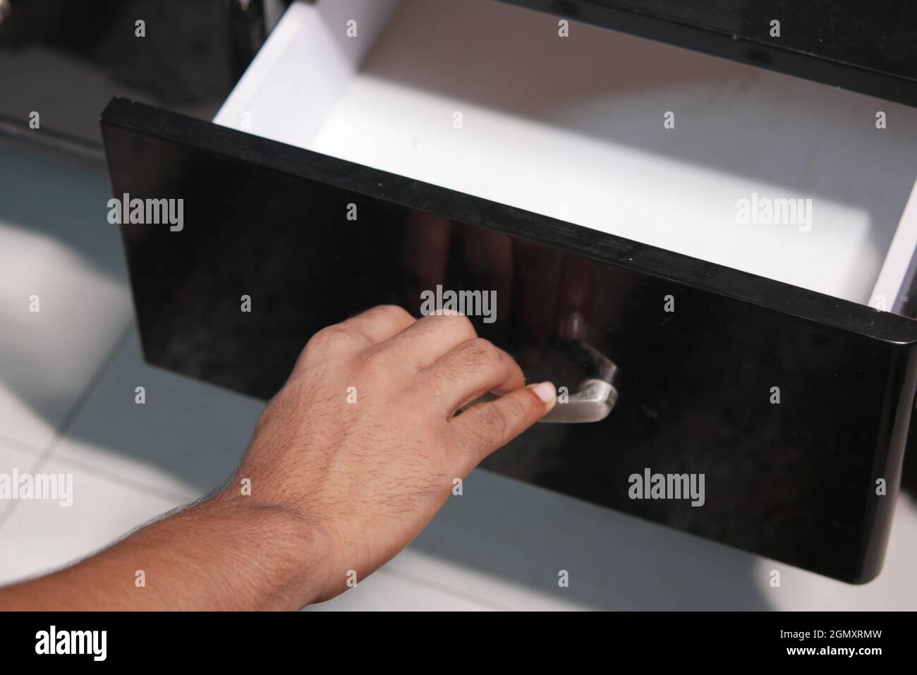 Open drawer man hi-res stock photography and images - Alamy